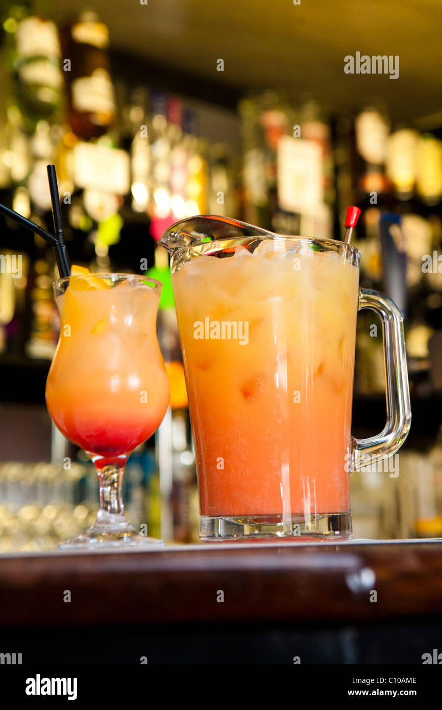 A photograph of a jug and glass filled with a cocktail drink, taken in ...