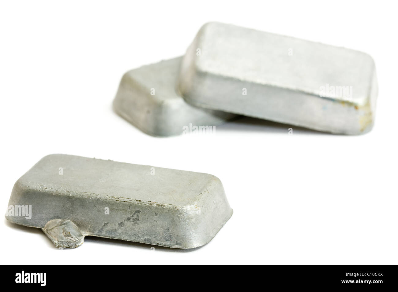 Three blocks of lead over white background Stock Photo - Alamy