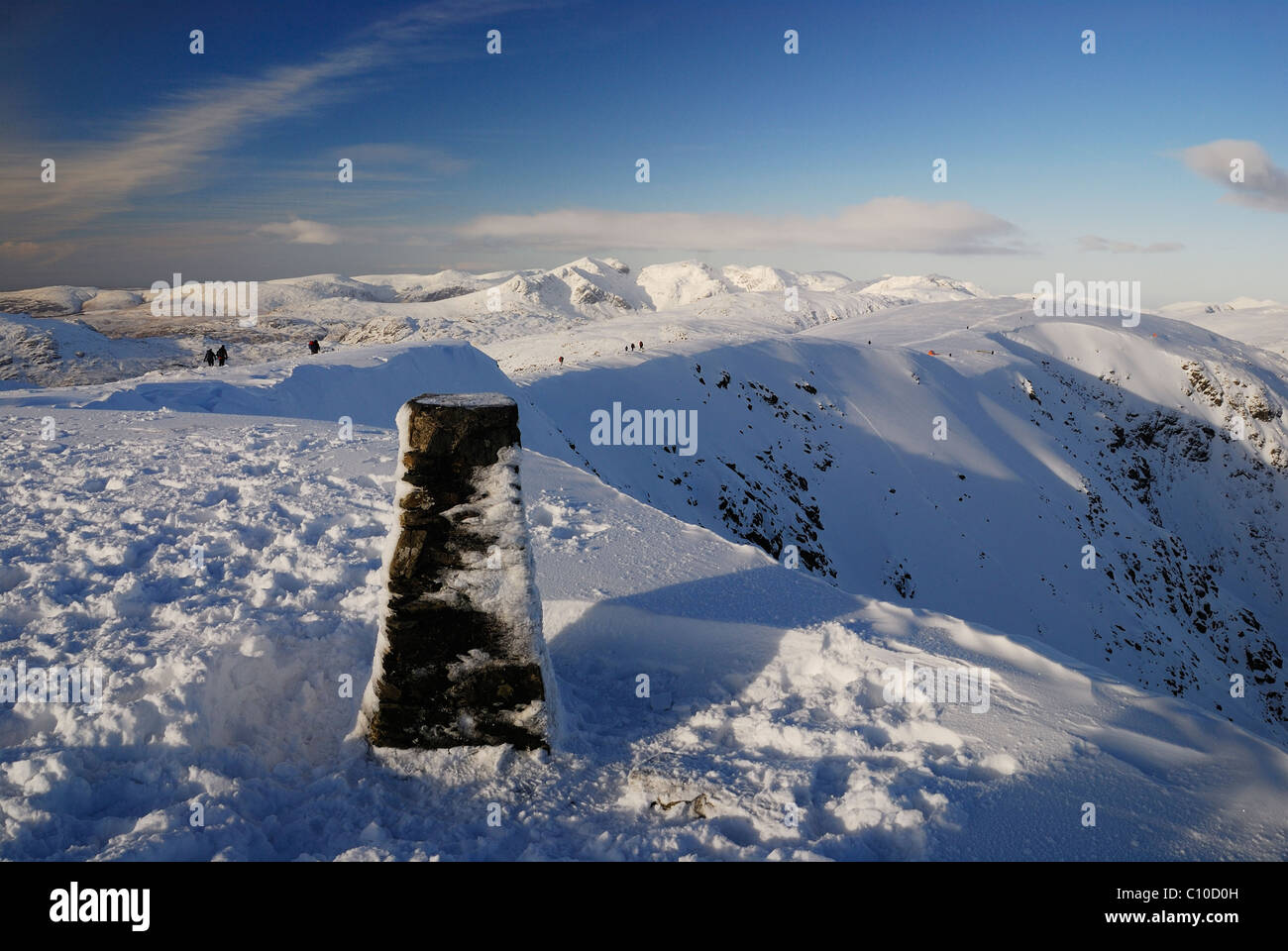 Summit cairn on the Old Man of Coniston in winter in the English Lake ...