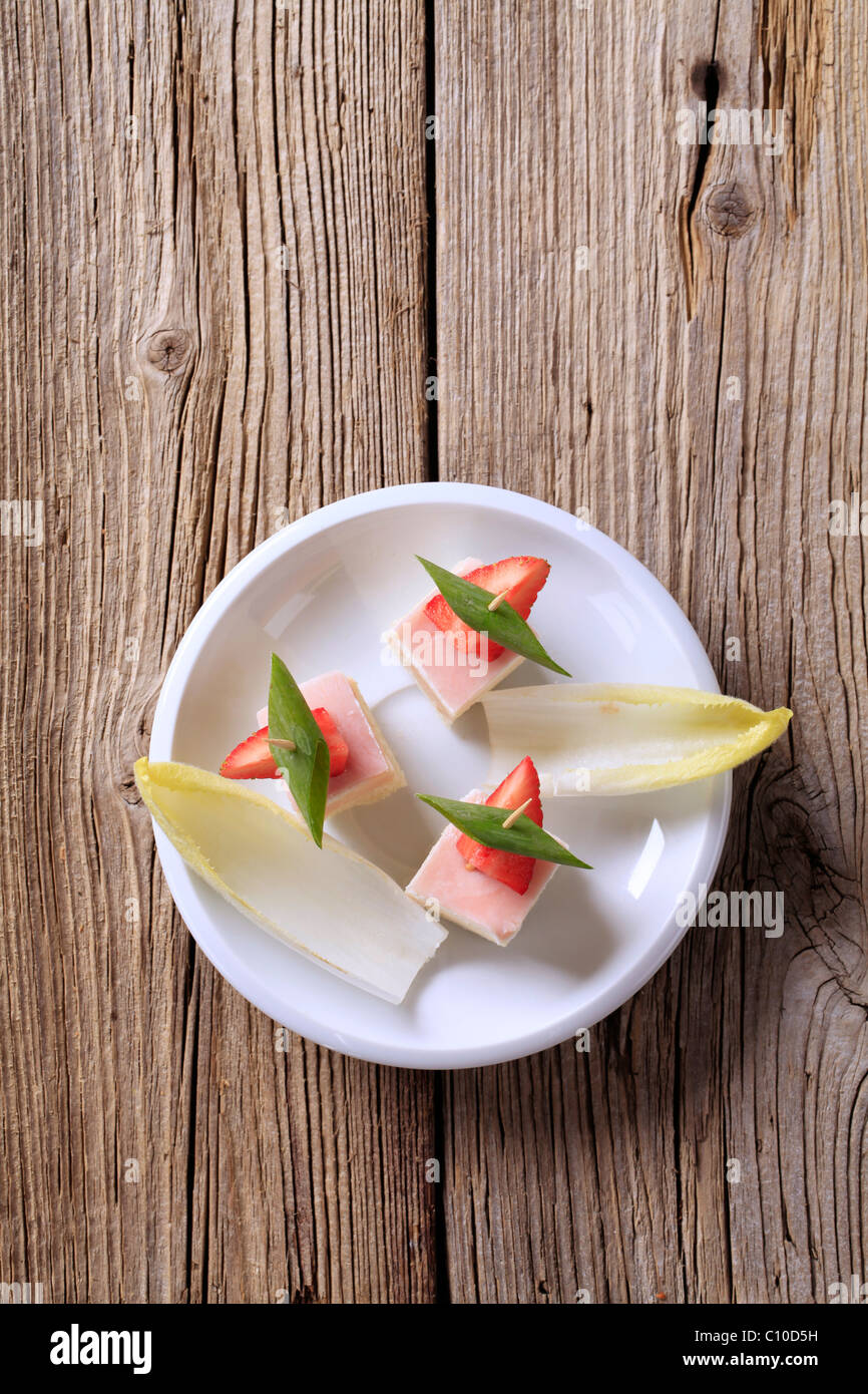 Ham and cheese canapes and endive - overhead Stock Photo - Alamy