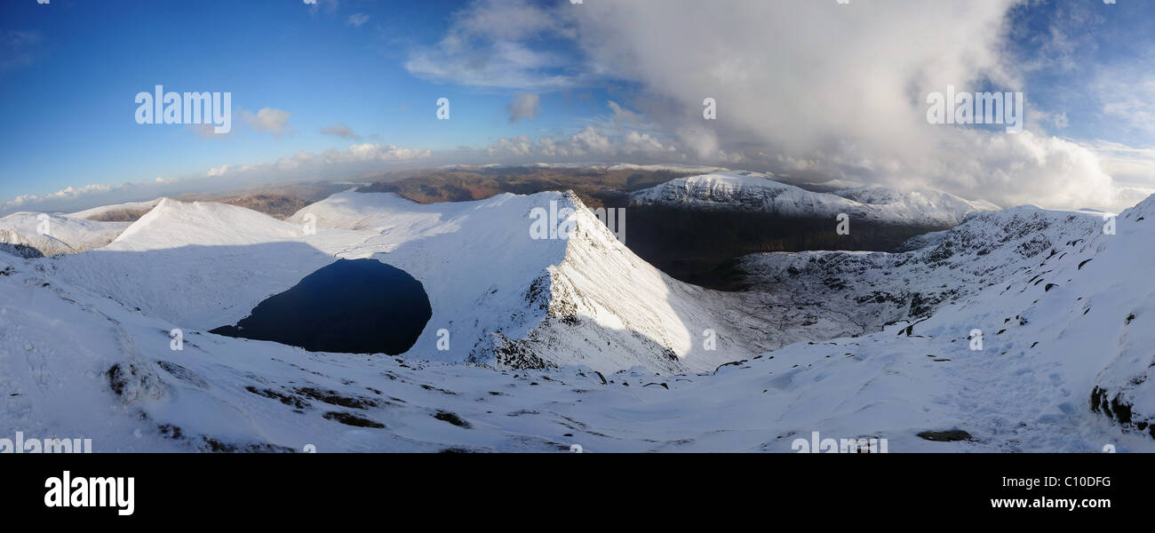 Panorama of Striding Edge and Red Tarn from Helvellyn in winter in the ...