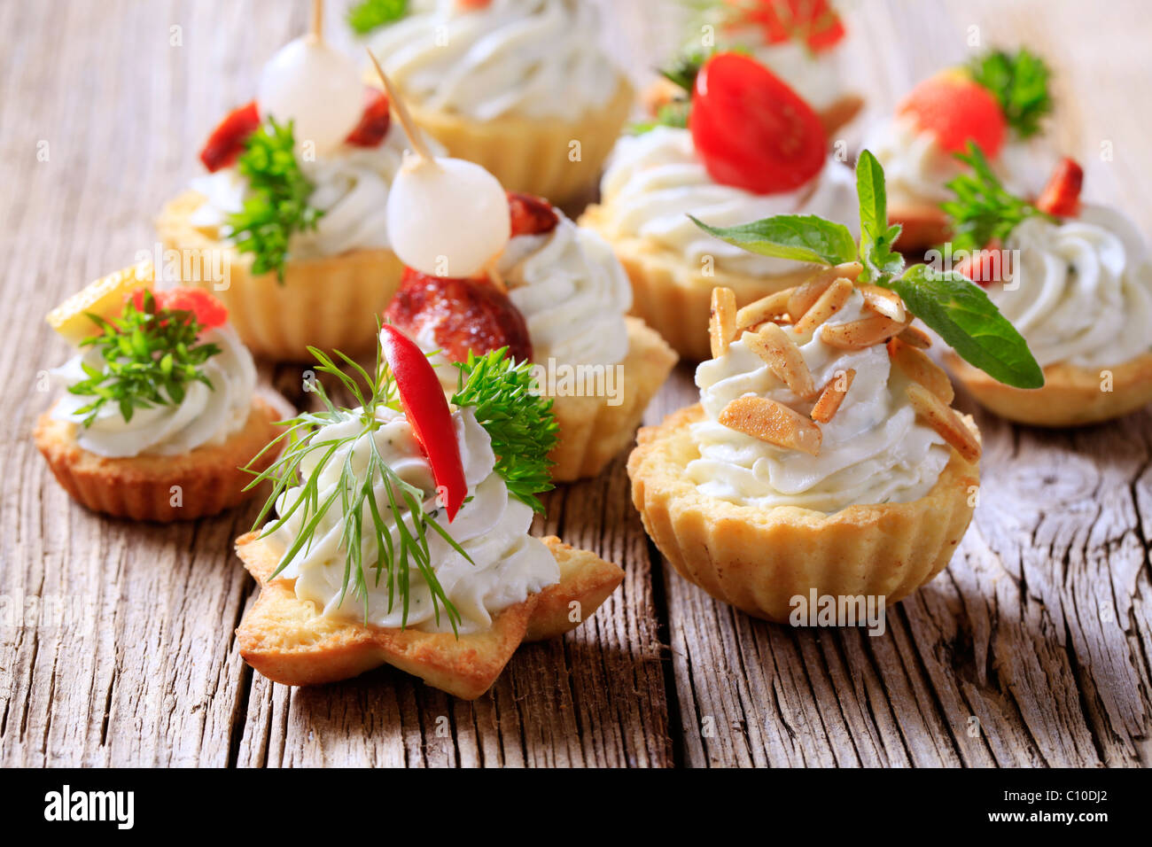 Variety of pastry-based canapes with various toppings Stock Photo - Alamy