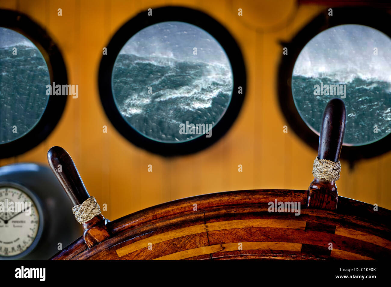 LOOKING THROUGH THREE PORTHOLES AT A STORM FROM SHIP'S CABIN Stock ...