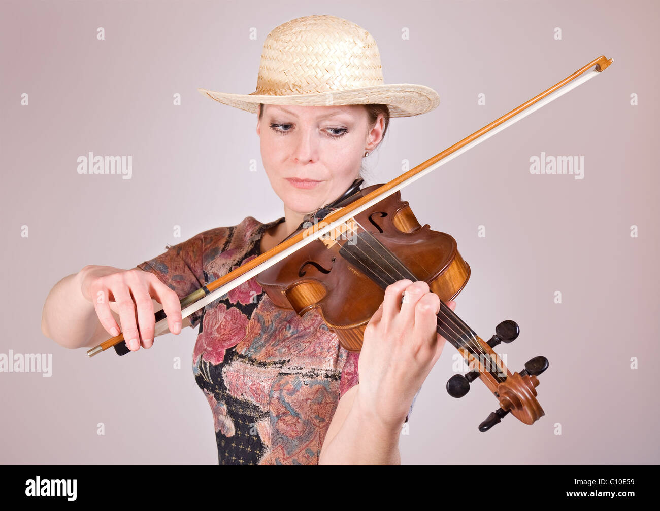 young woman plays the viola Stock Photo - Alamy