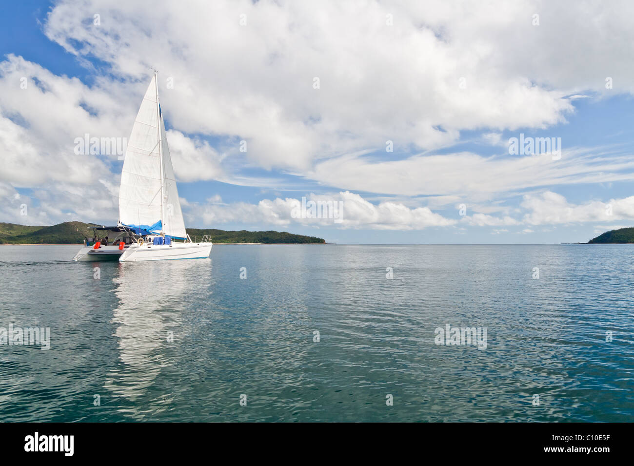 Luxury white catamaran boat in the bay Stock Photo - Alamy