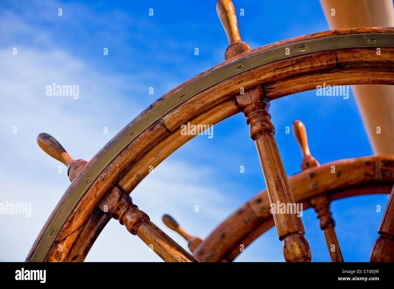 SHIP'S WOOD STEERING WHEELS CLOSEUP WITH WARM SUNSET SKY Stock Photo ...
