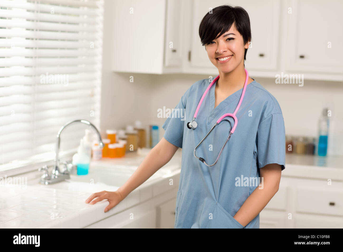 Smiling Attractive Mixed Race Doctor Or Nurse In An Office Or
