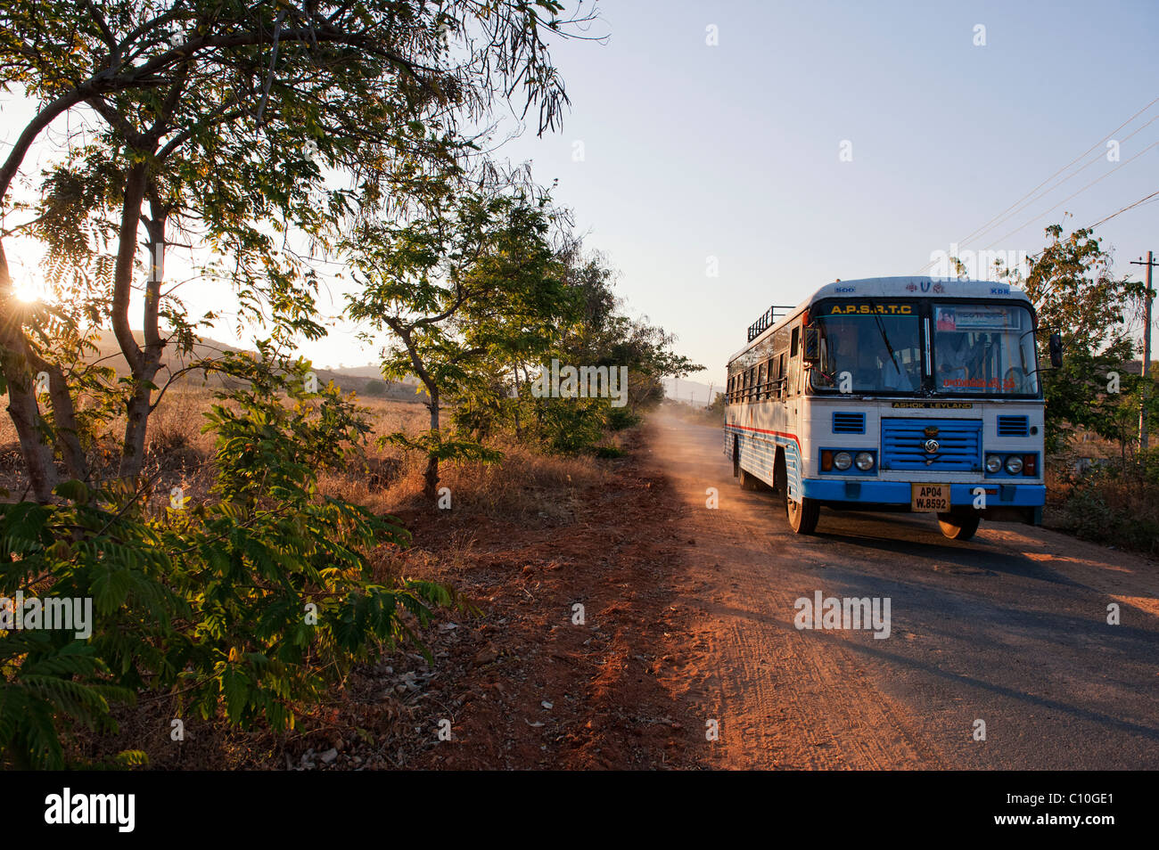Indian bus / coach traveling early morning at sunrise in the ...
