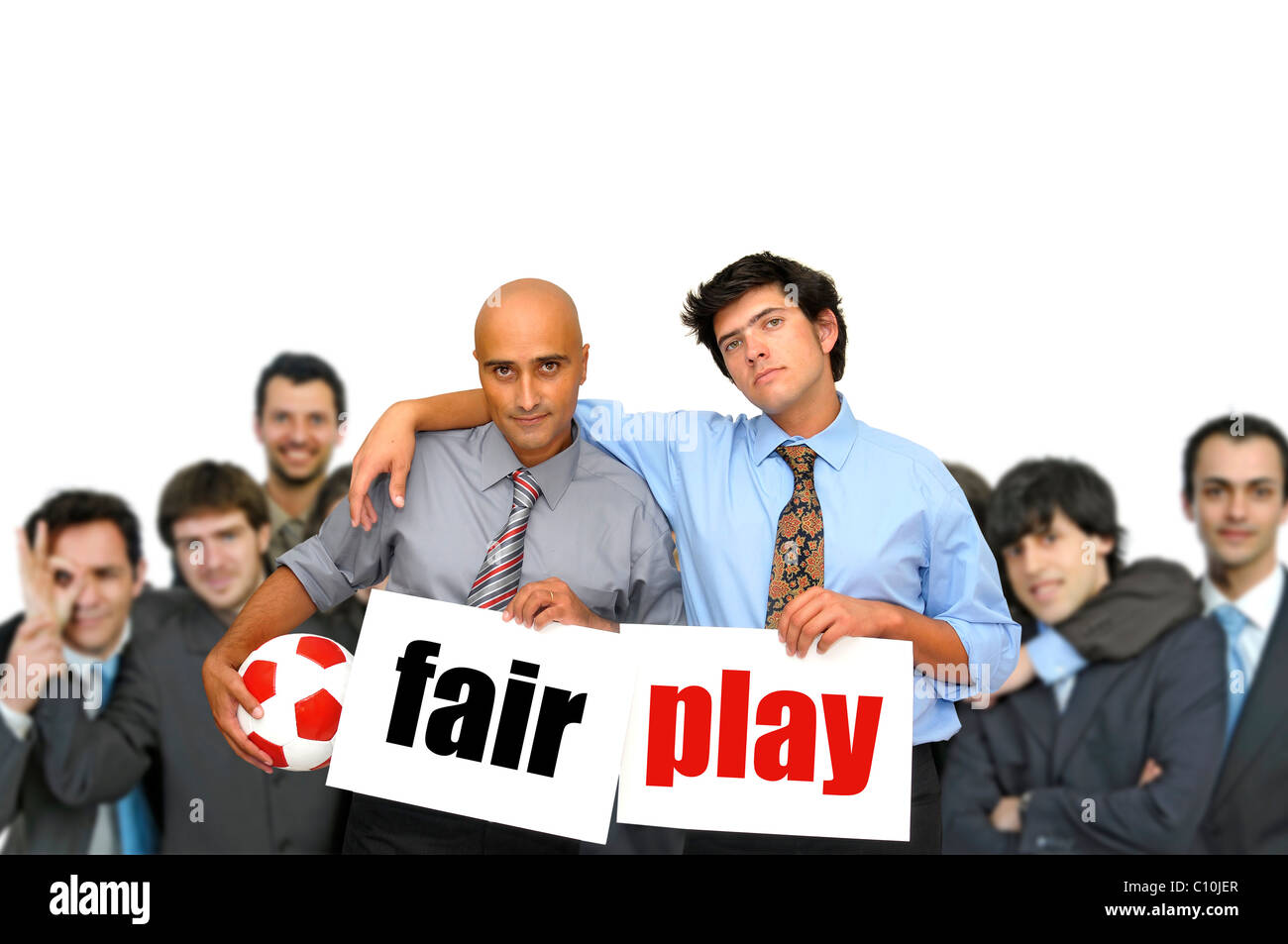 Team of businessmen with soccer ball and white cards with the words ...