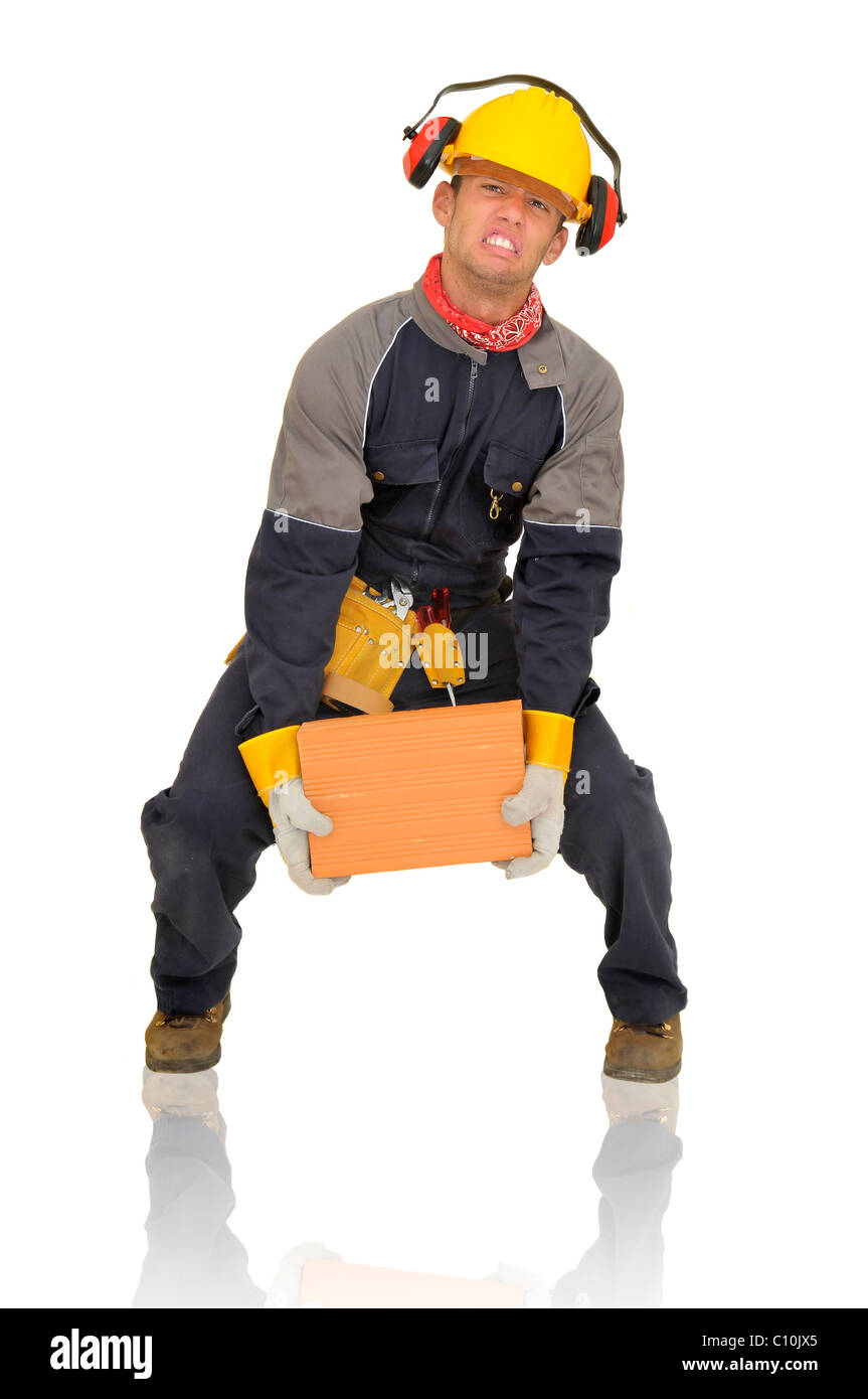Construction worker lifting a heavy brick isolated in white Stock Photo ...
