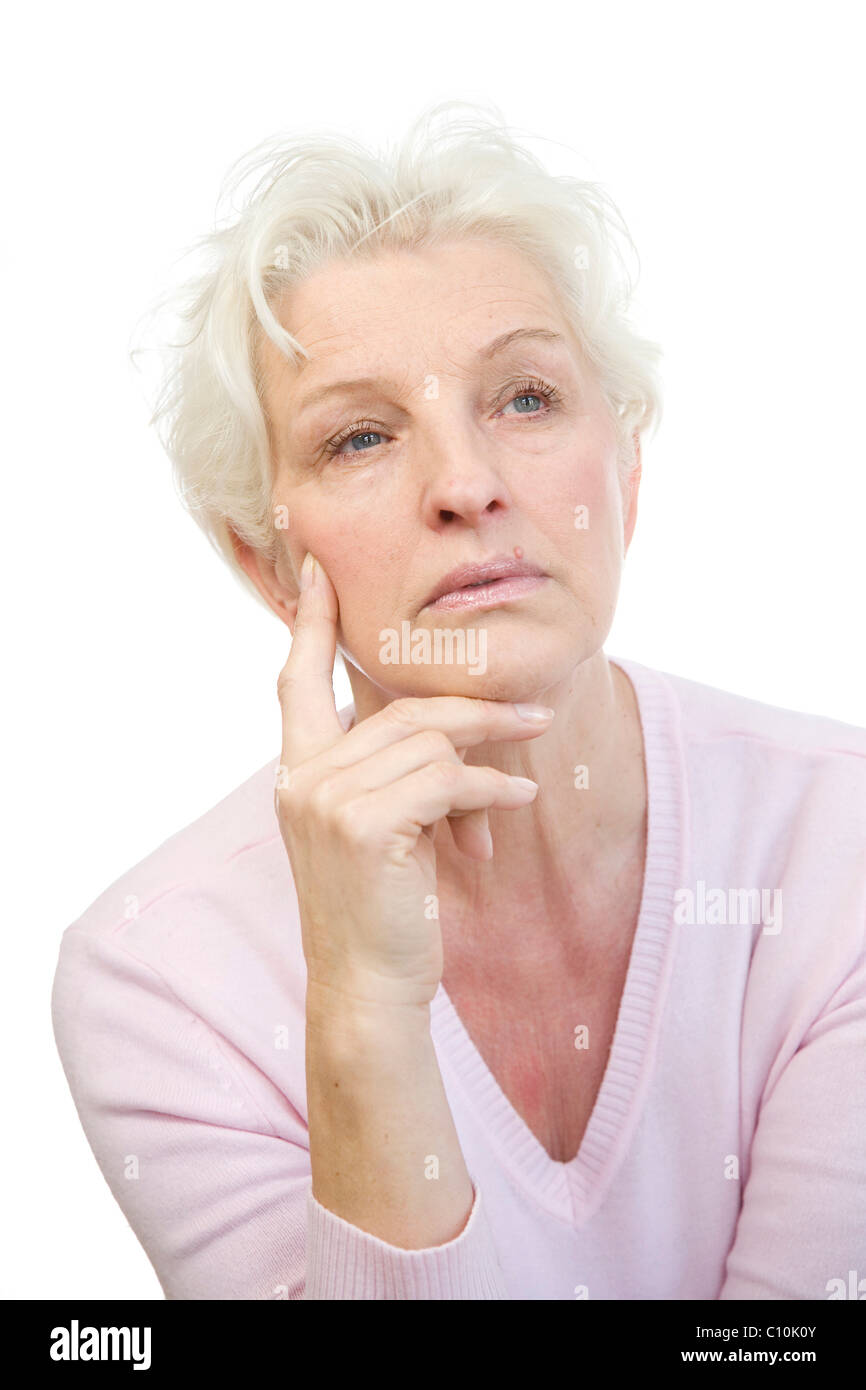 A mature woman looking thoughtfully into the distance Stock Photo - Alamy