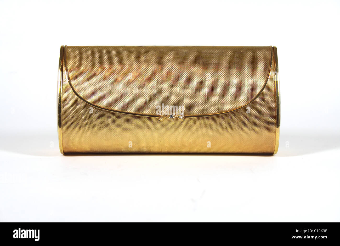 Gold colored metal clutch with flap. c1980s style Stock Photo - Alamy