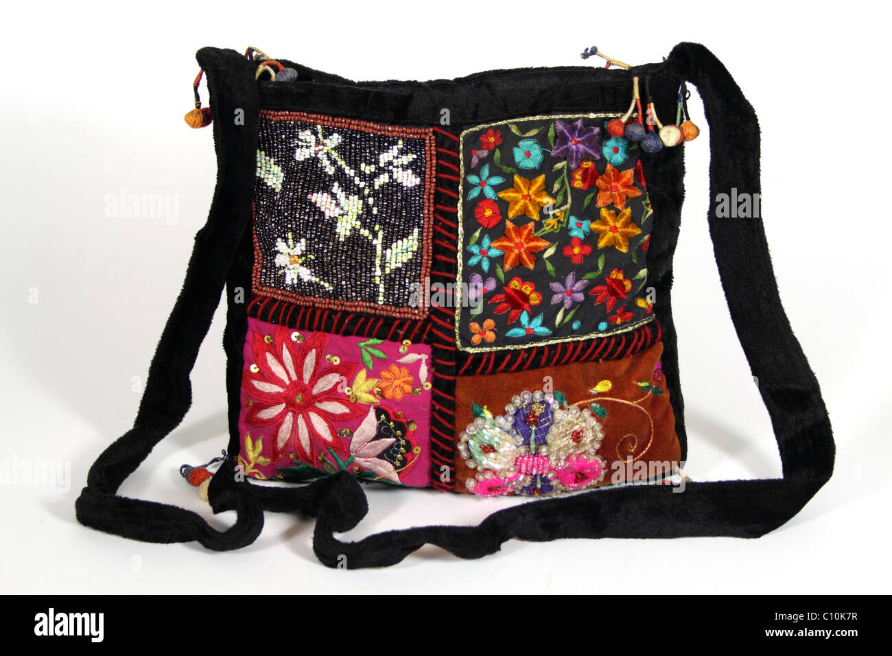 Indian bag, crafted from various squares of embroidery and with long ...