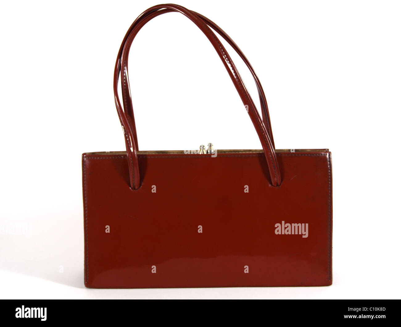Brown, plastic long handled handbag Stock Photo - Alamy