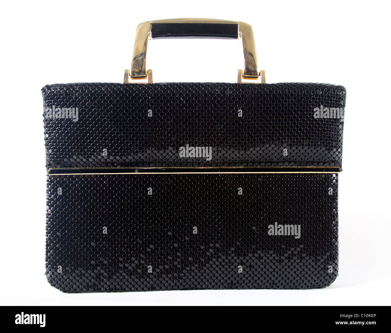 Black, mesh surface, female handbag with gold metal handle Stock Photo ...