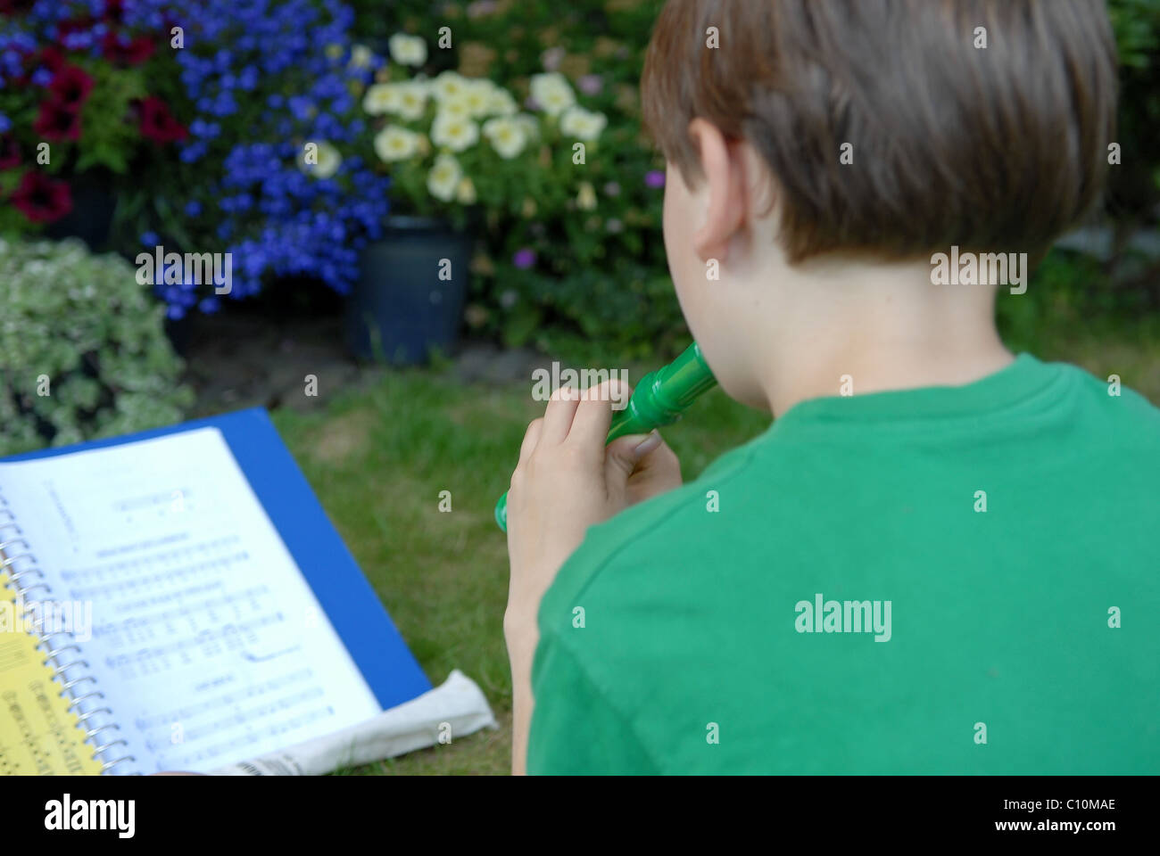 Young boy playing recorder Stock Photo - Alamy