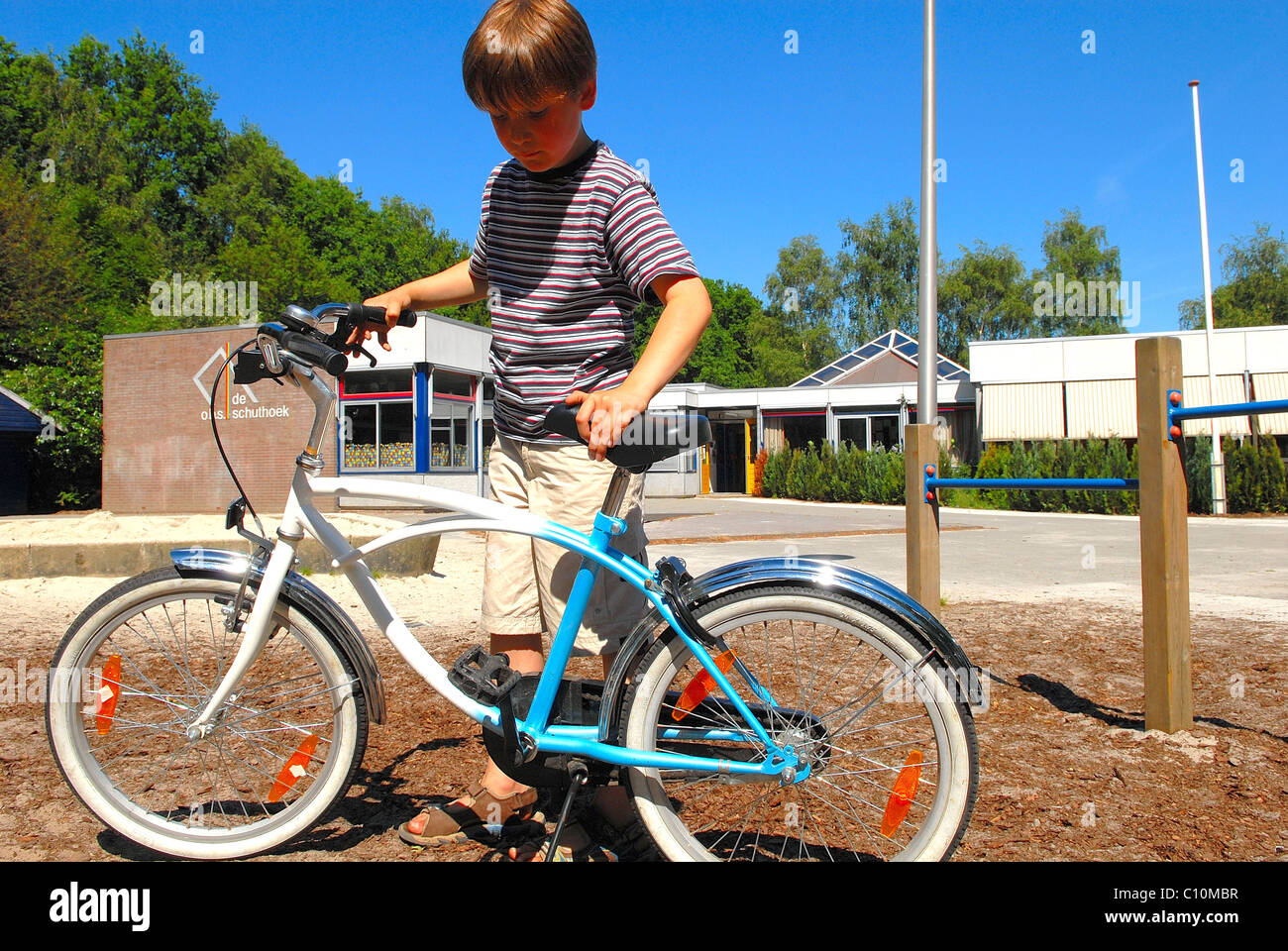 Young boy cycling on bike Stock Photo - Alamy