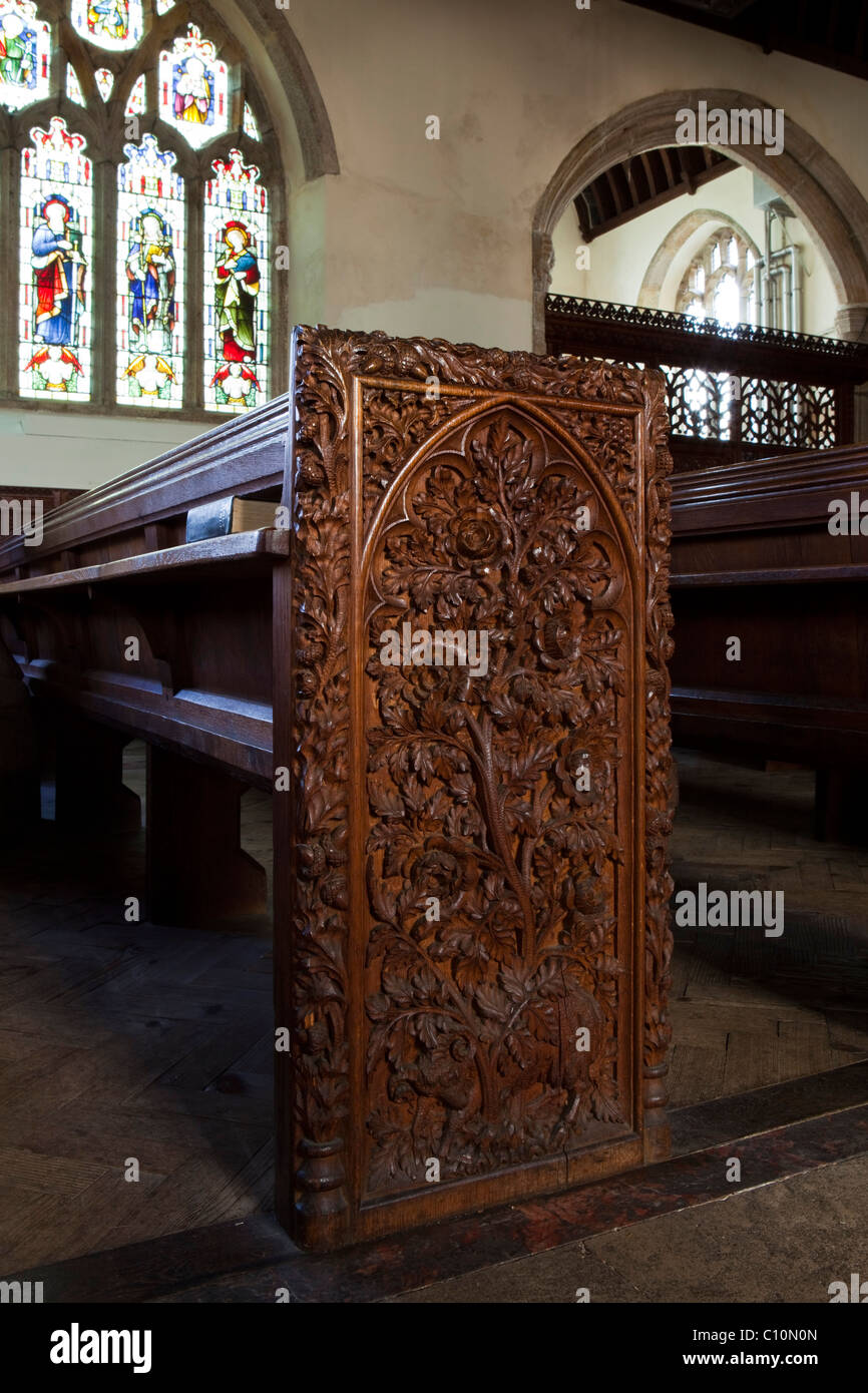 All Saints church, Holbeton, Devon, decorative wooden pews Stock Photo ...