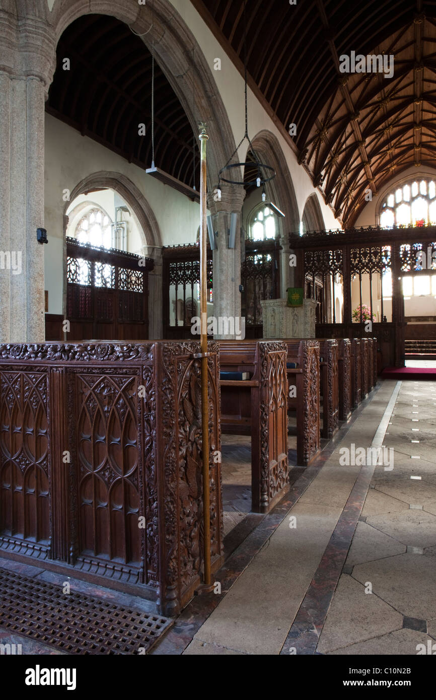 All Saints church, Holbeton, Devon, decorative wooden pews Stock Photo ...