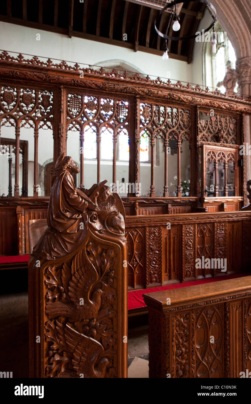 All Saints church, Holbeton, Devon, decorative wooden pews Stock Photo ...