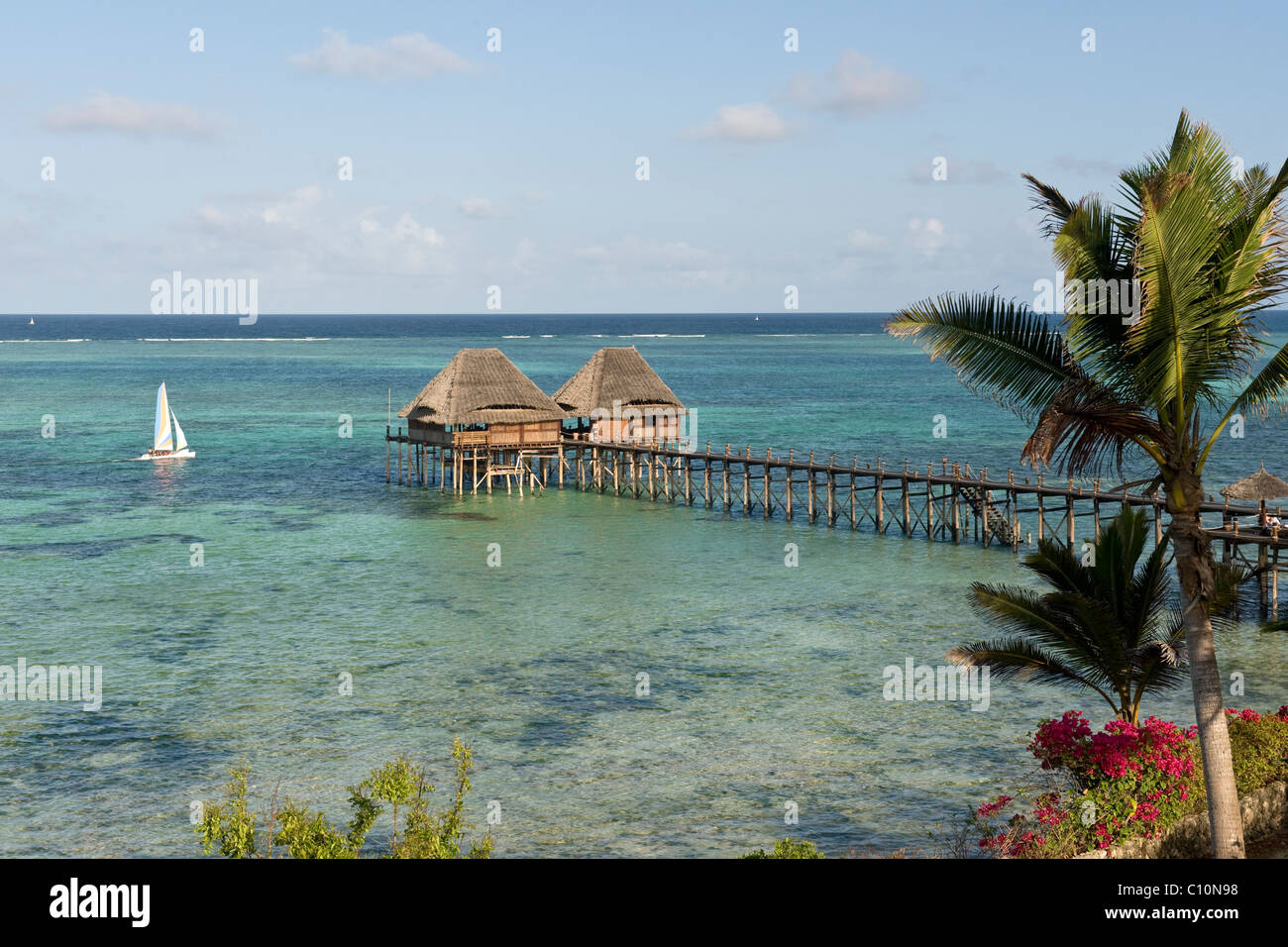 Pier over a lagoon south coast of Zanzibar Stock Photo - Alamy