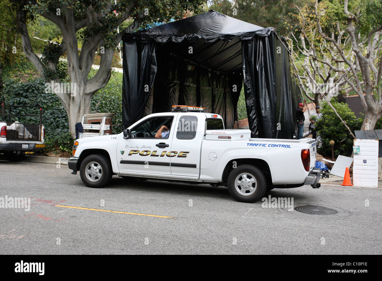 A police traffic control car outisde ahead of Jennifer Aniston's 40th ...