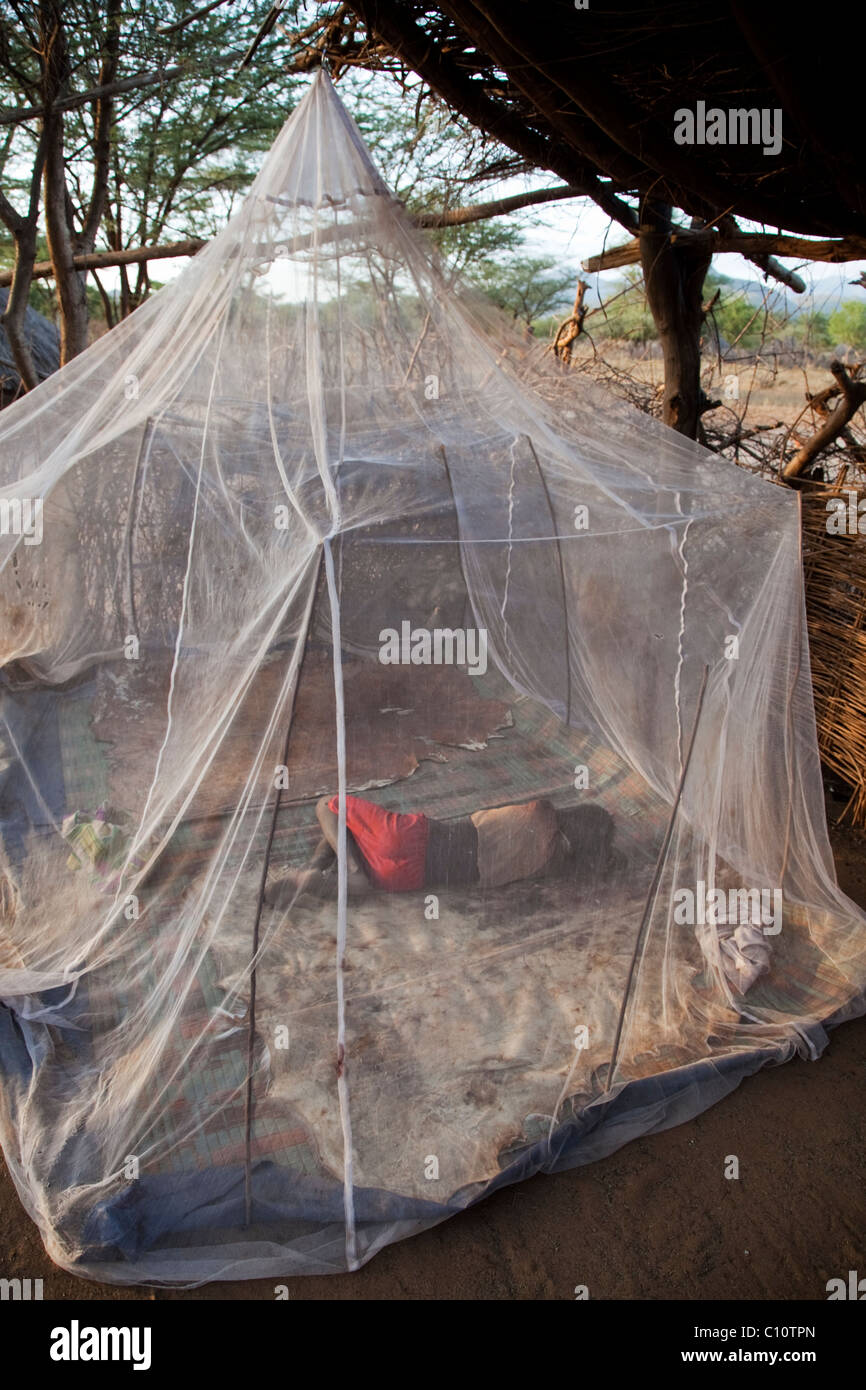 Sleeping under mosquito net hi-res stock photography and images - Alamy