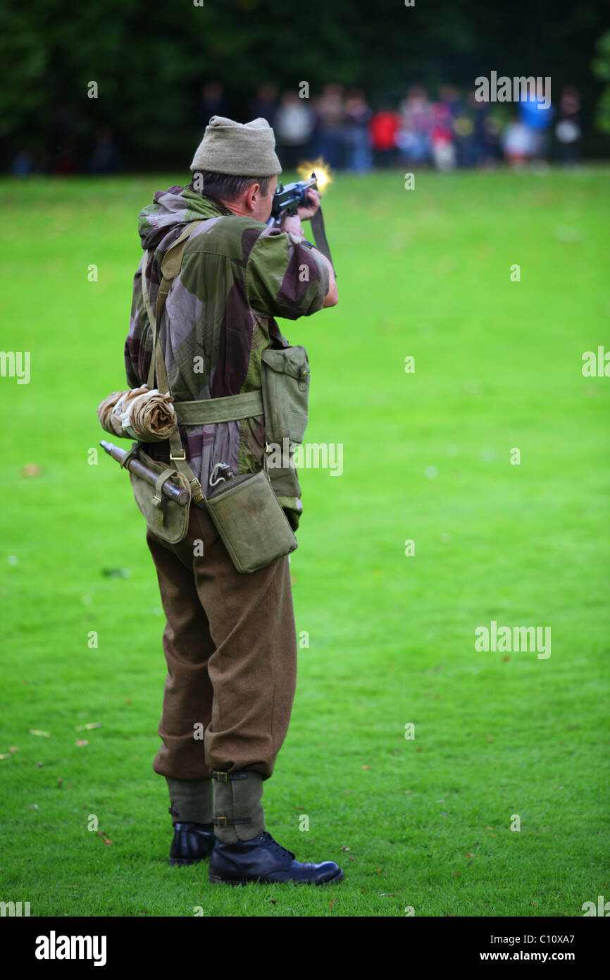 Reconstruction WW2 British soldier firing Thompson sub-machine gun with ...