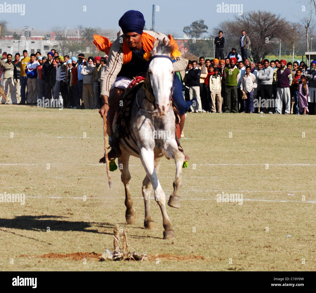 A Nihang Sikh an ancient Sikh warrior tries his hands at tent pegging ...