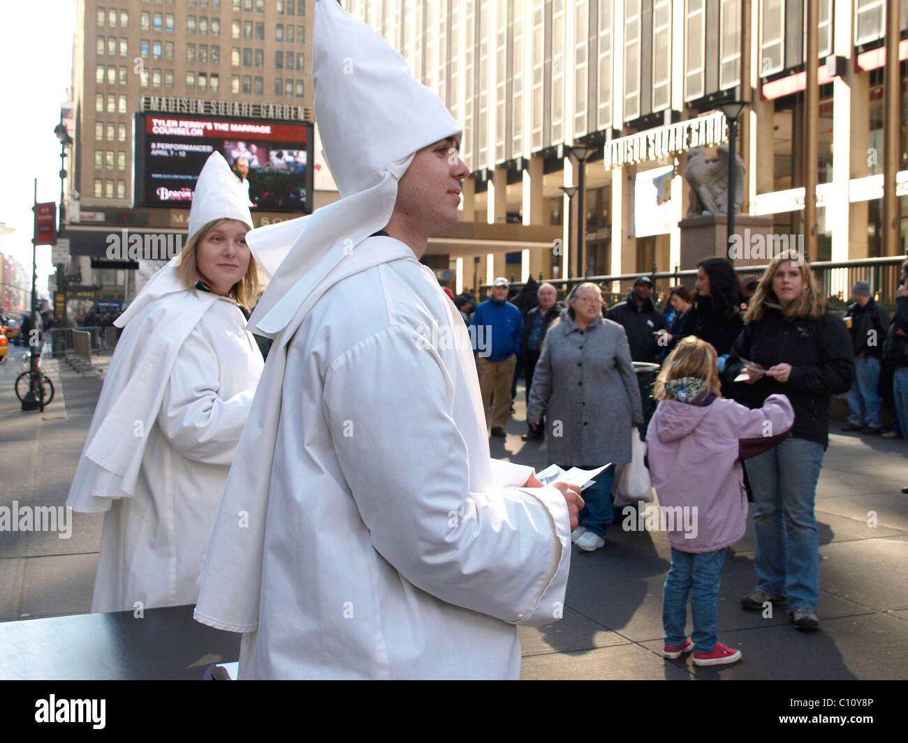 PETA members dressed in Ku Klux Klan white robes and conical hats ...