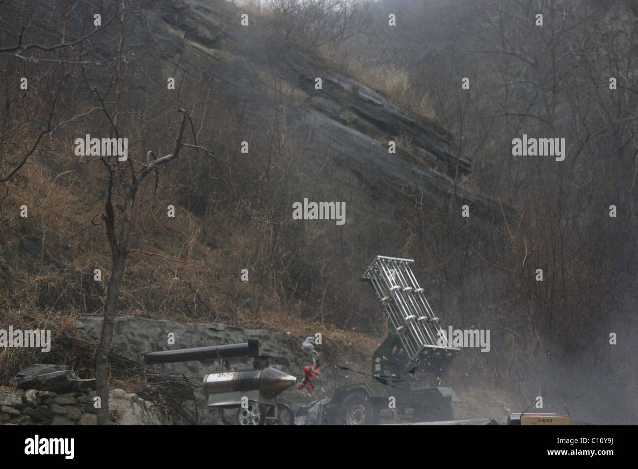 Rainmaker Workers in China release chemicals into the atmosphere in a ...