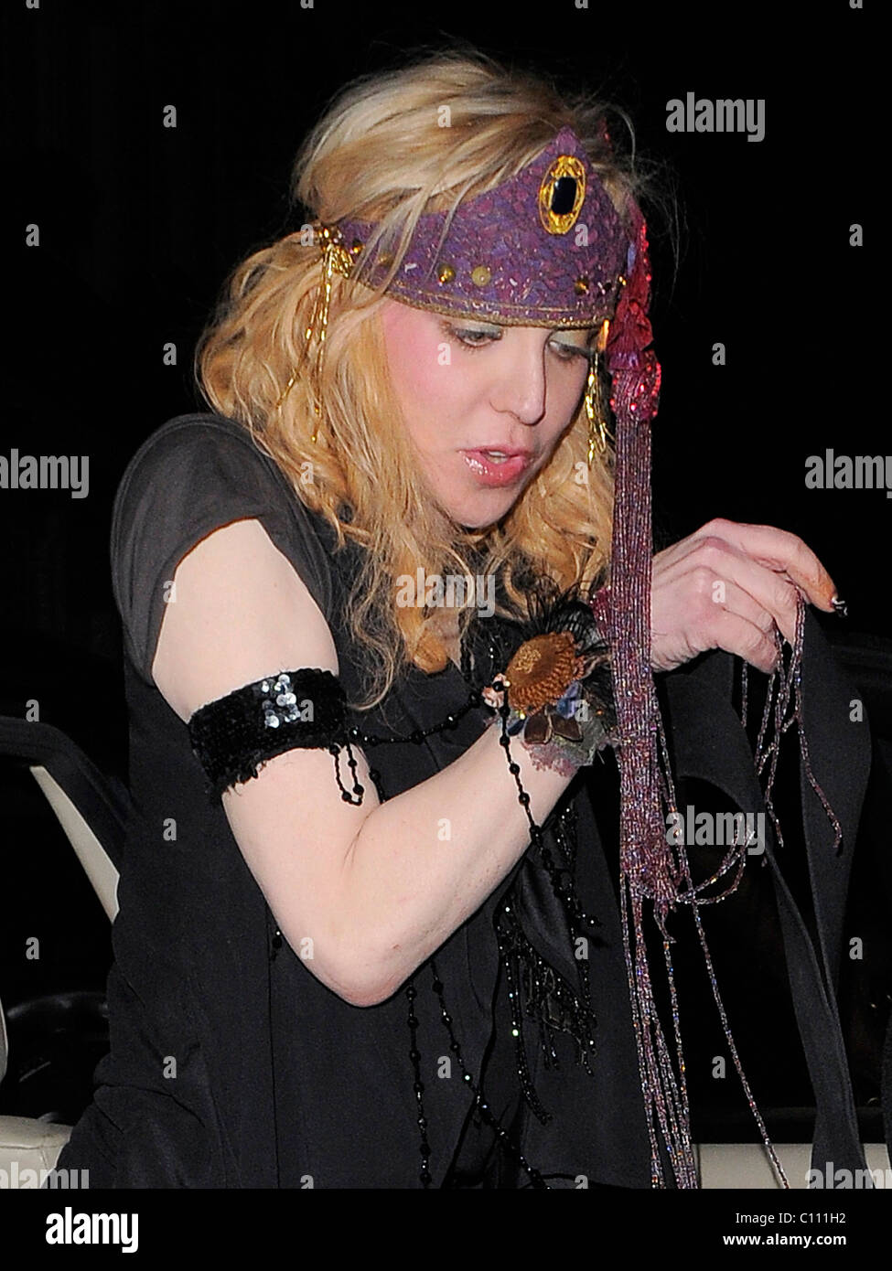 Courtney Love arrives back at her hotel shortly after 4am, smoking a ...