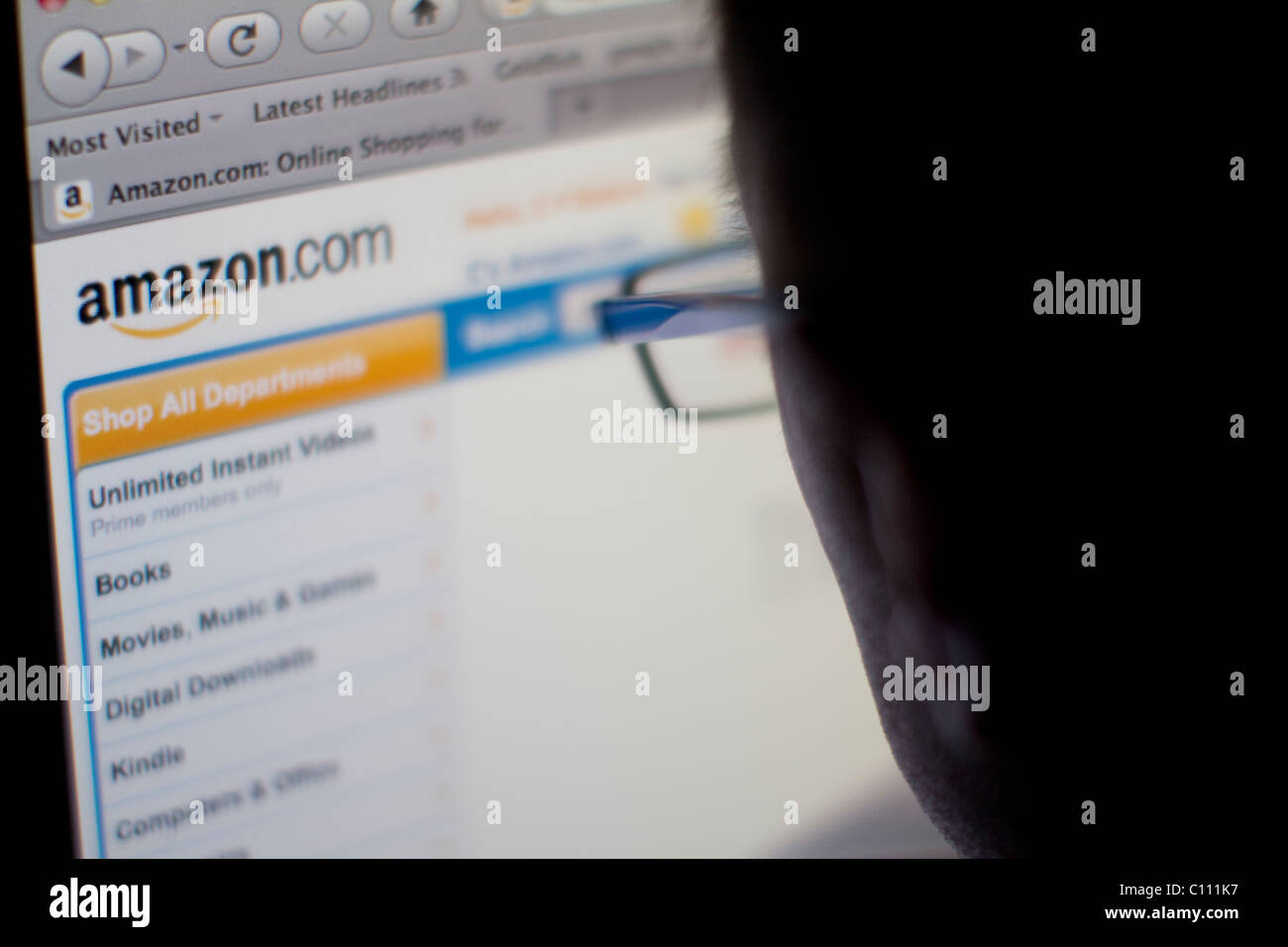 Close up silhouette of man viewing internet website Amazon Stock Photo ...