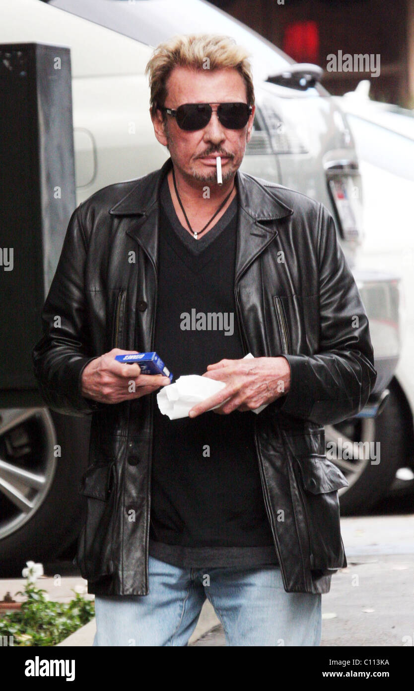Johnny Hallyday heads home after having lunch at a nearby cafe Las ...