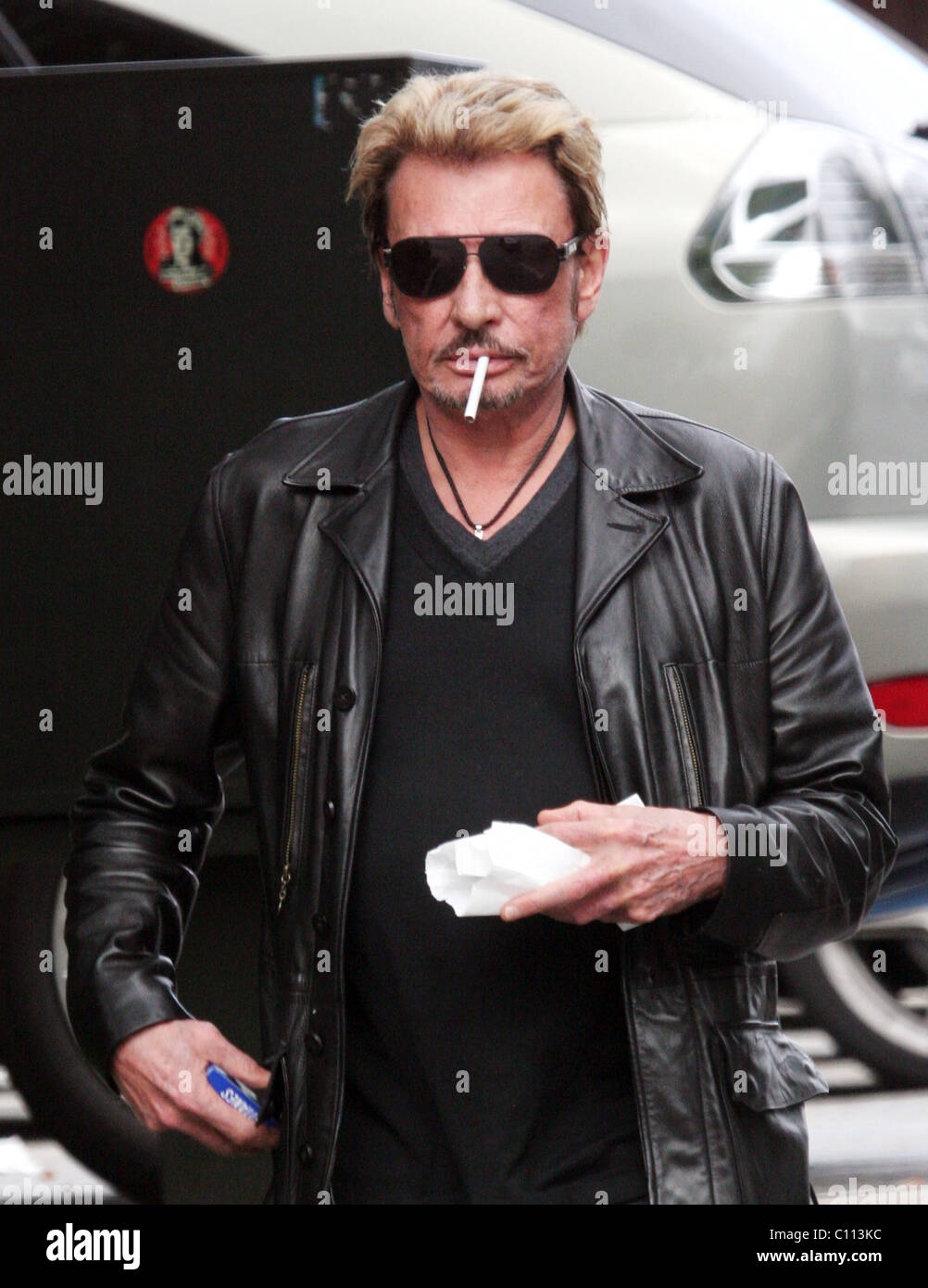 Johnny Hallyday heads home after having lunch at a nearby cafe Las ...