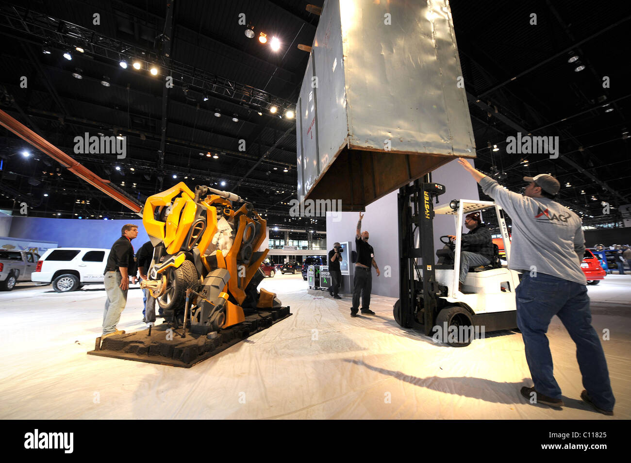 TRANSFORMER TOWERS OVER CAR SHOW This replica of a Transformers Autobot ...