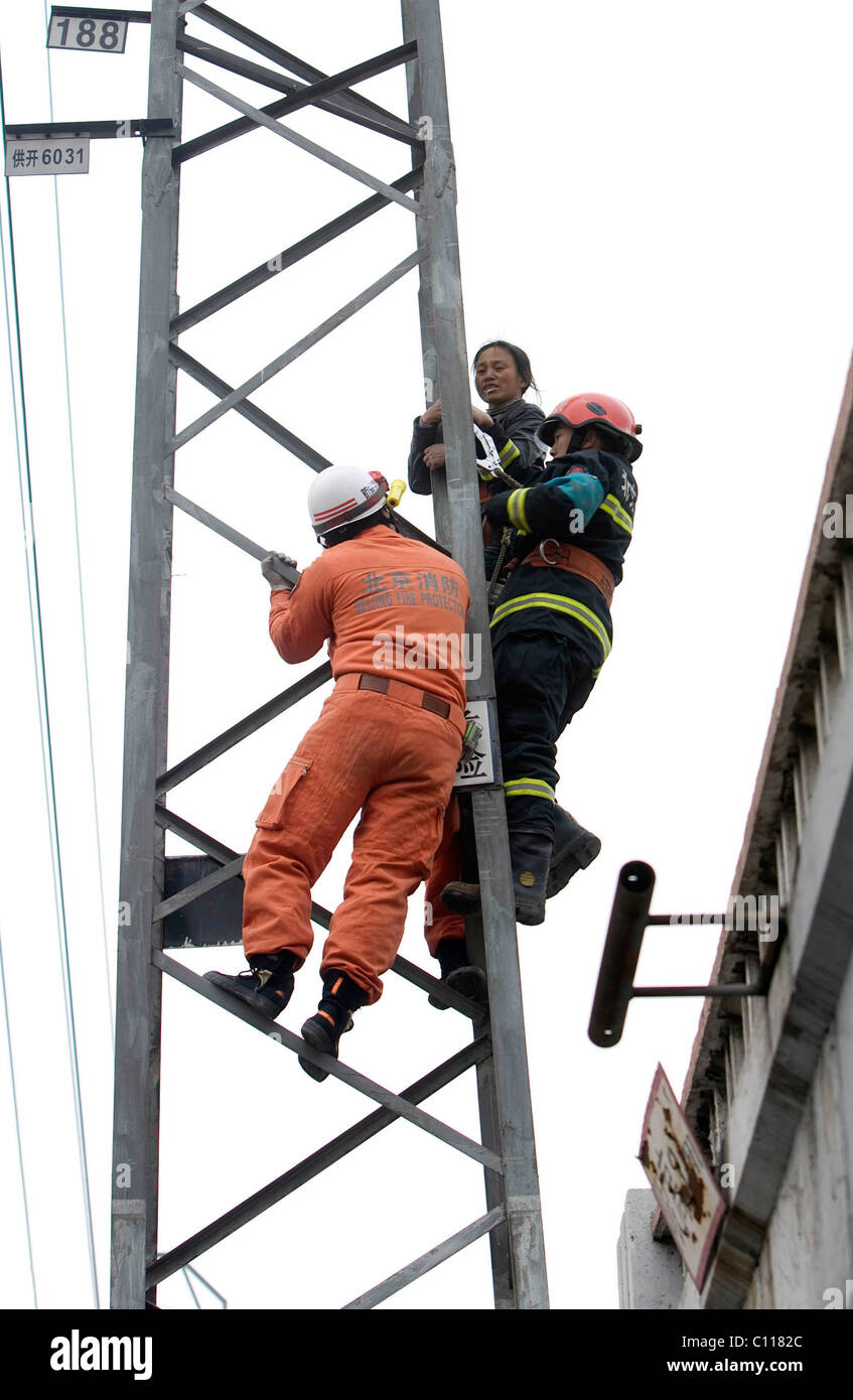 DEATH WISH WOMAN SAVED A distraught woman stands poised to plunge to ...