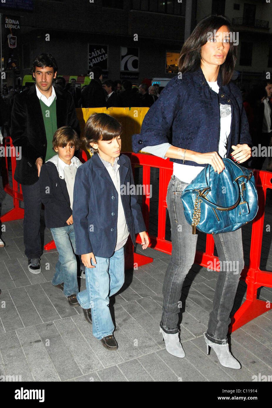 Real Madrid football star Raul and his family attend a basketball game ...