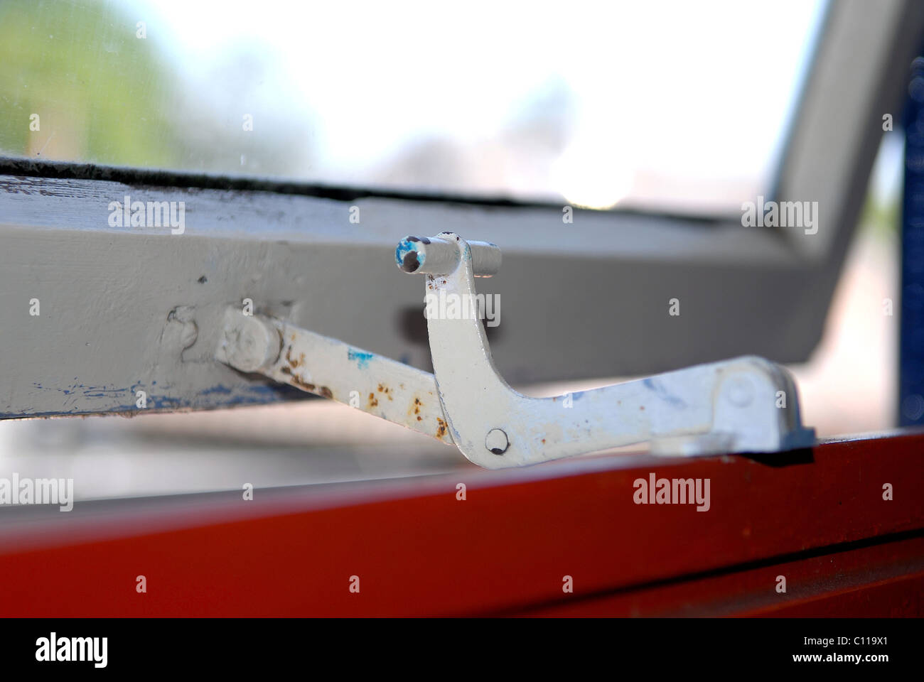 Close-up of lever on window Stock Photo - Alamy