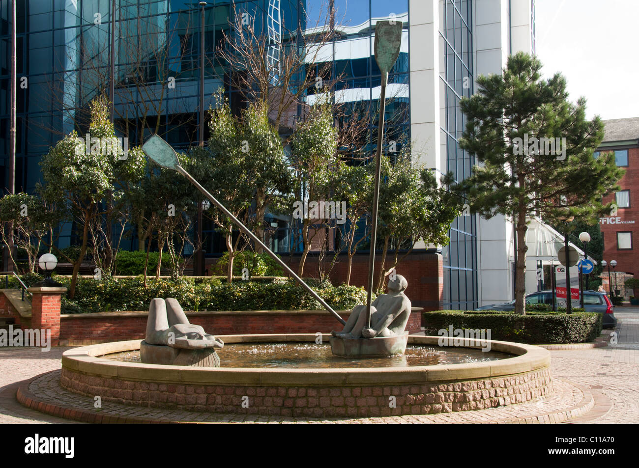 Man in a boat sculpture and fountain at Exchange Quay, Salford ...