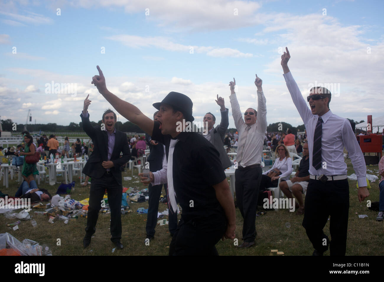 Spectators celebrate a wicket during a game of cricket at the Royal ...