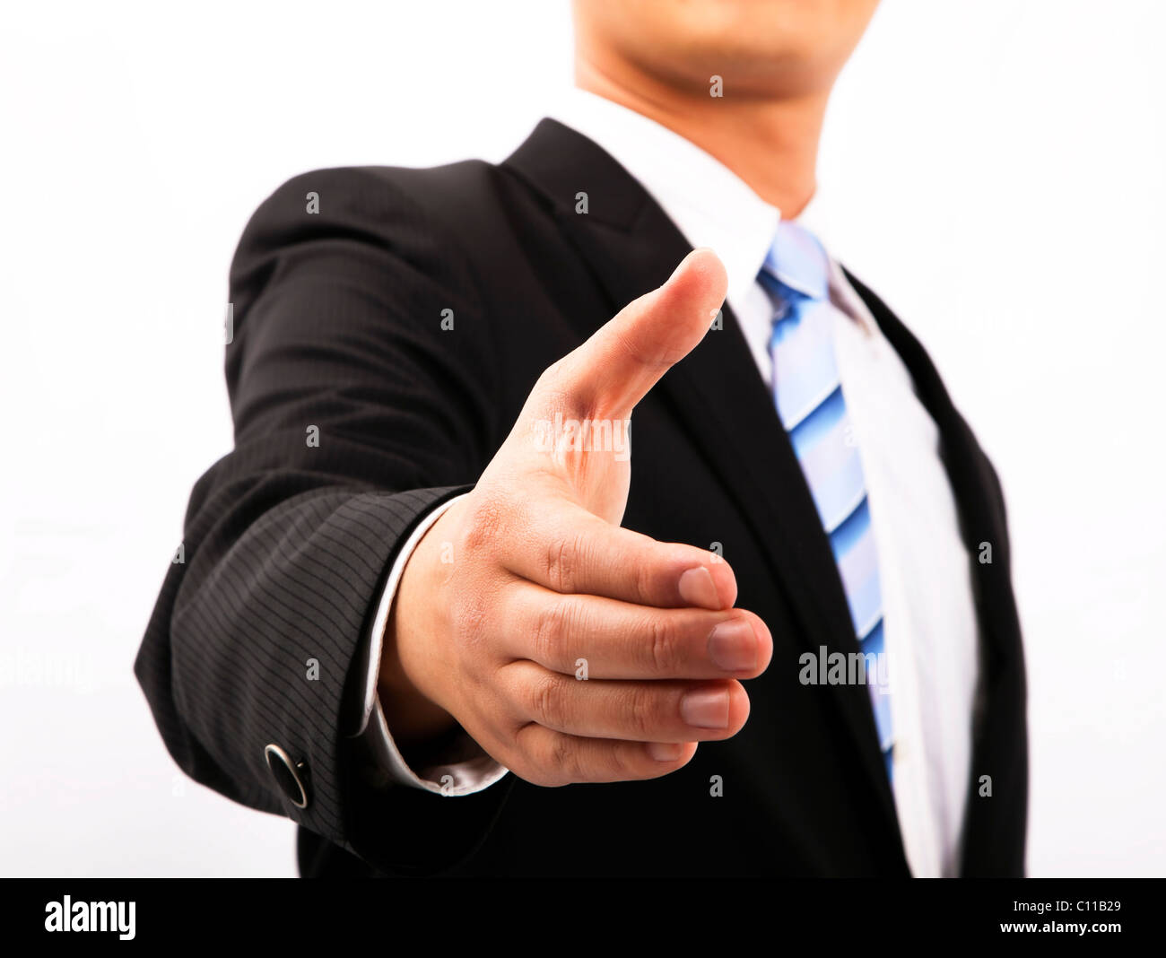 Close up of business man extending hand to shake Stock Photo - Alamy