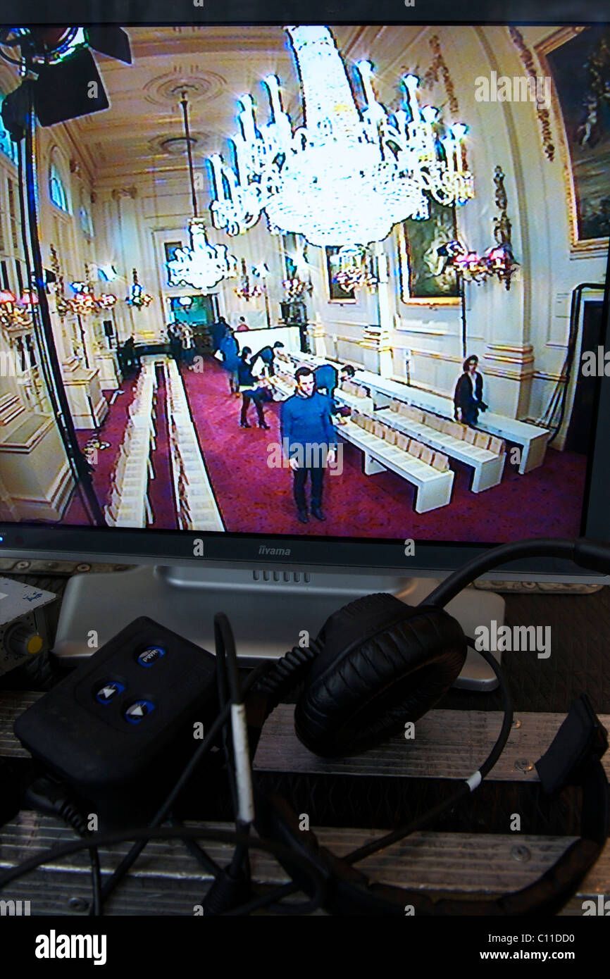 A monitor backstage captures a model stand-in doing a catwalk run ...