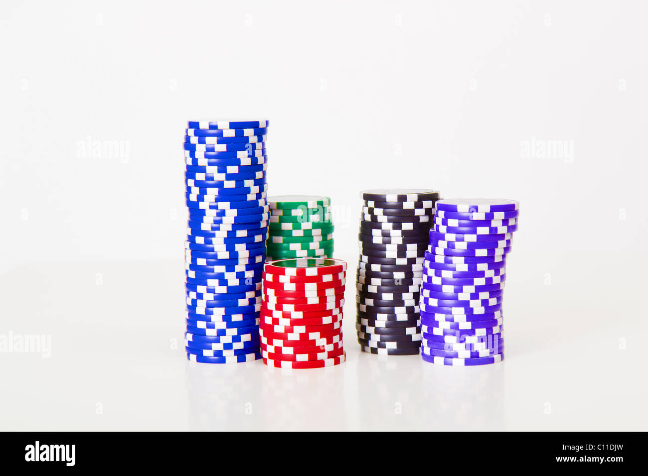 stack of poker chips on a white background Stock Photo - Alamy
