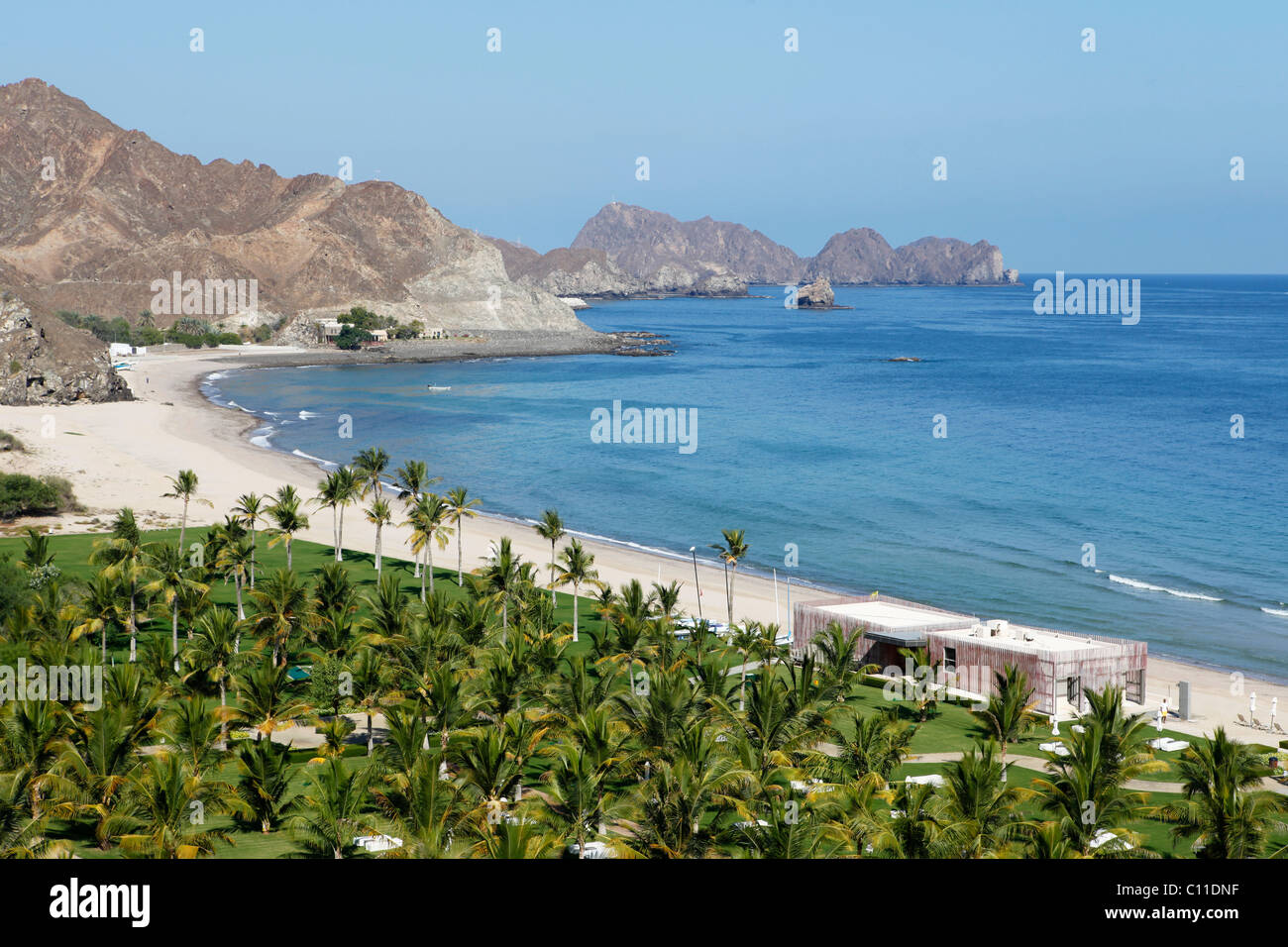 Golden sands and blue sea at Muscat in Oman Stock Photo - Alamy