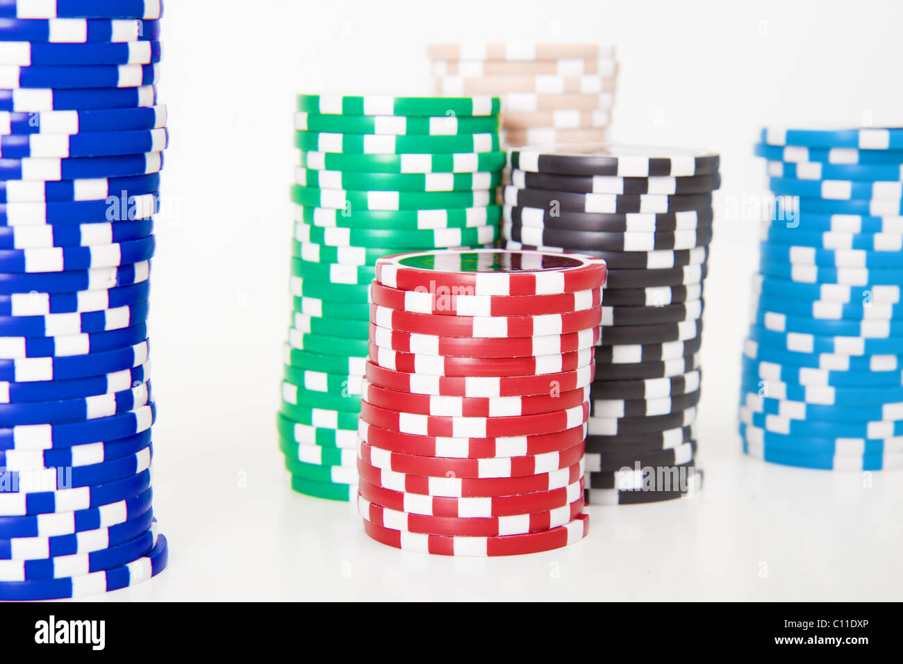 stack of poker chips on a white background Stock Photo - Alamy