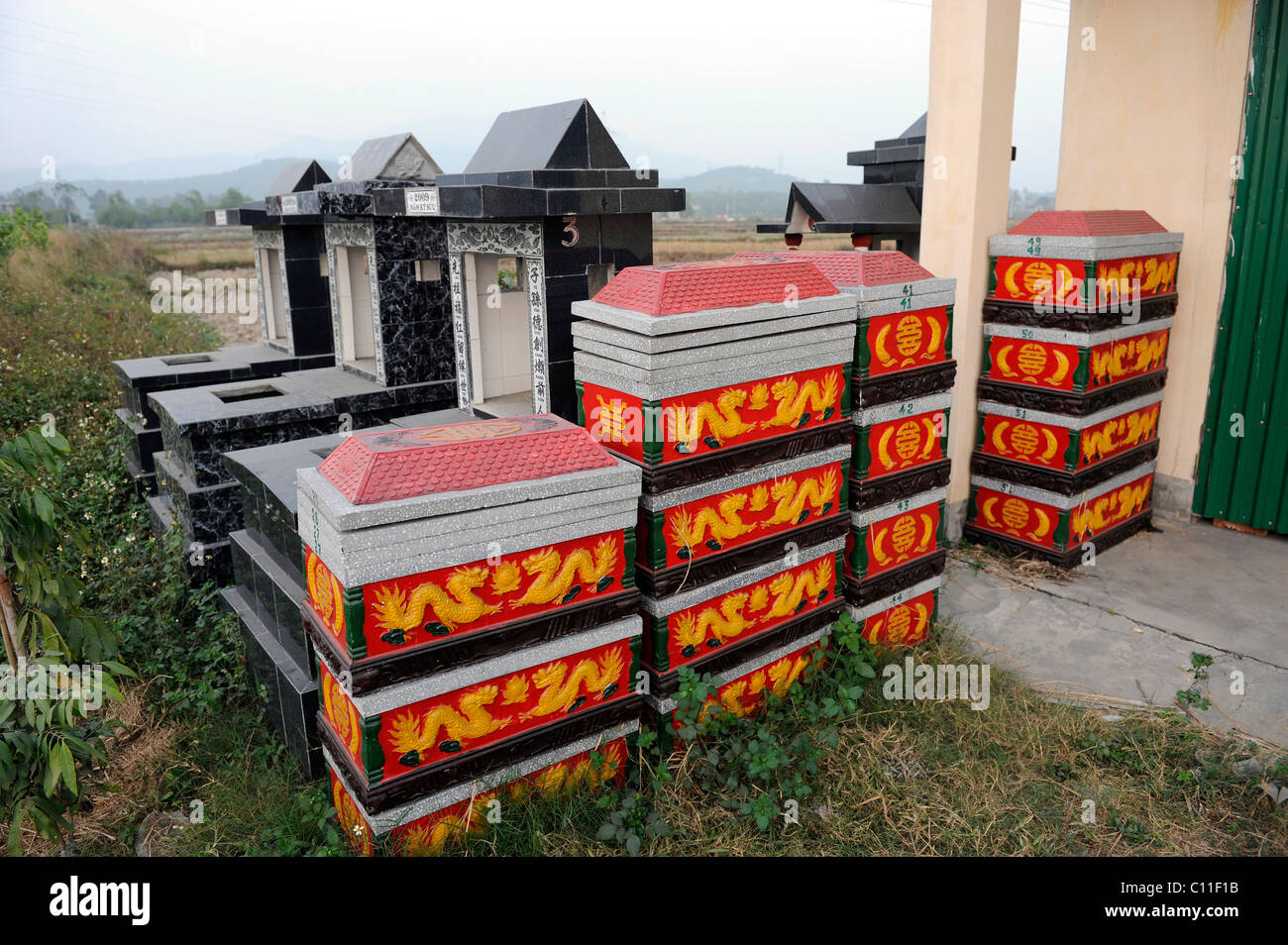 Stacked coffins at a cemetery near Hanoi, North Vietnam, Vietnam ...