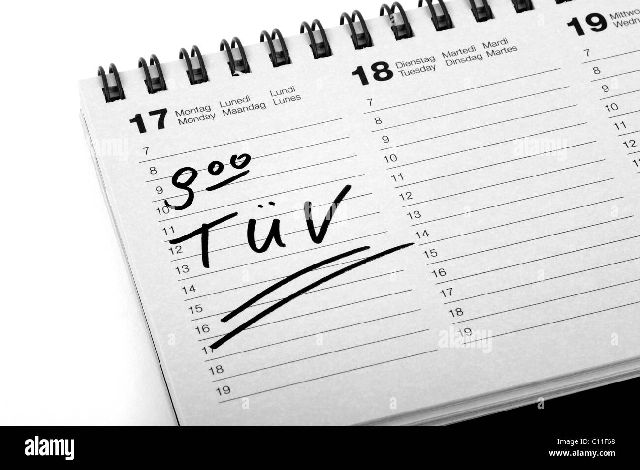 Entry "TUEV", car inspection, in a diary Stock Photo - Alamy