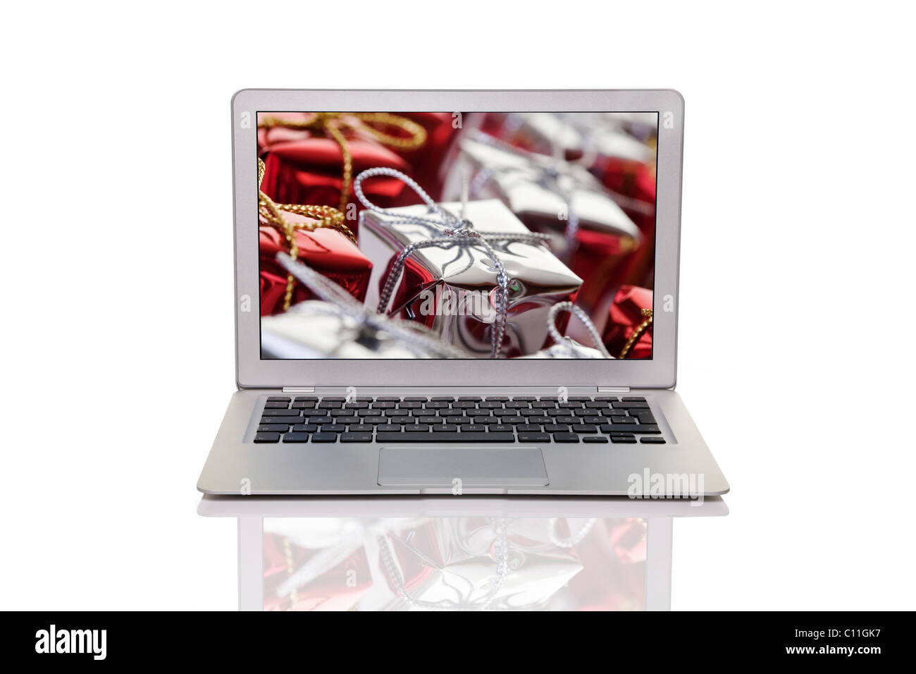 Laptop with Christmas presents Stock Photo - Alamy