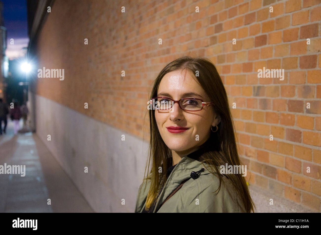 lady on a madrid street at night Stock Photo - Alamy
